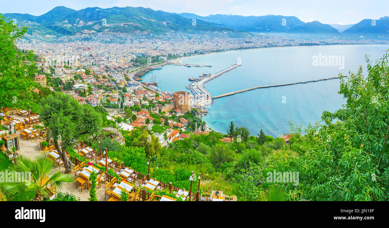 The architecture of old Alanya in frame of greenery, growing on the ...