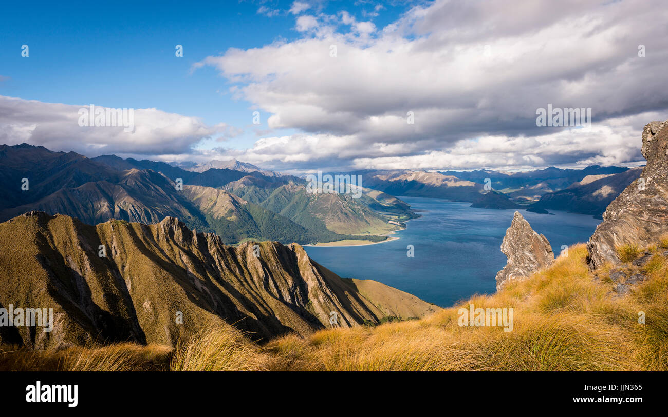 View of lake in mountain landscape, rugged landscape, Lake Hawea, Otago ...