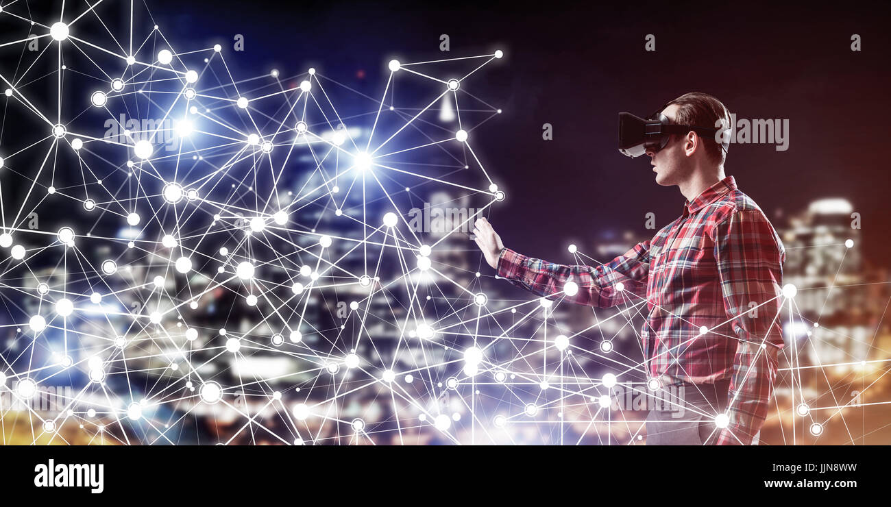 Guy wearing checked shirt and virtual mask reaching hand to feel Stock ...