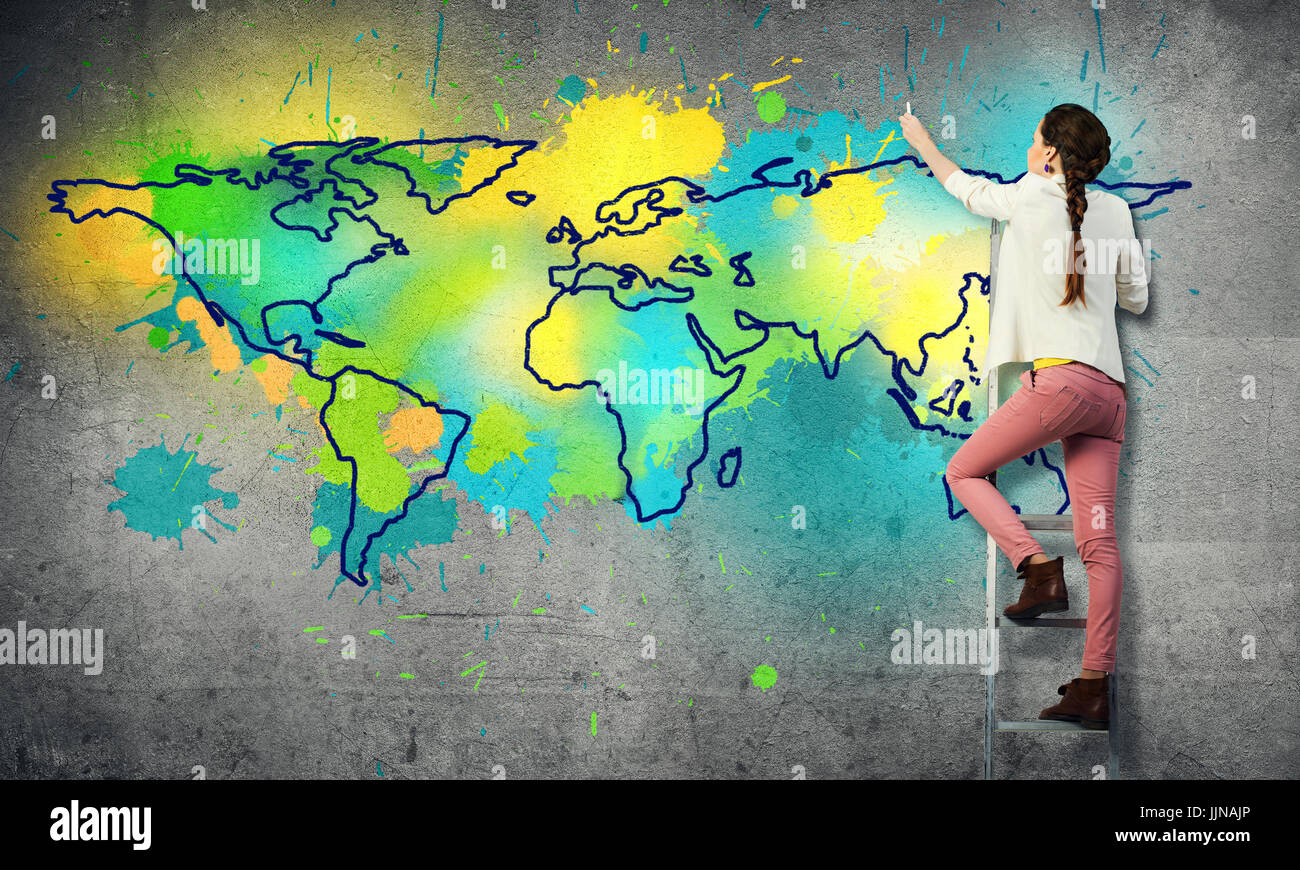 Girl paint wall in colors Stock Photo - Alamy