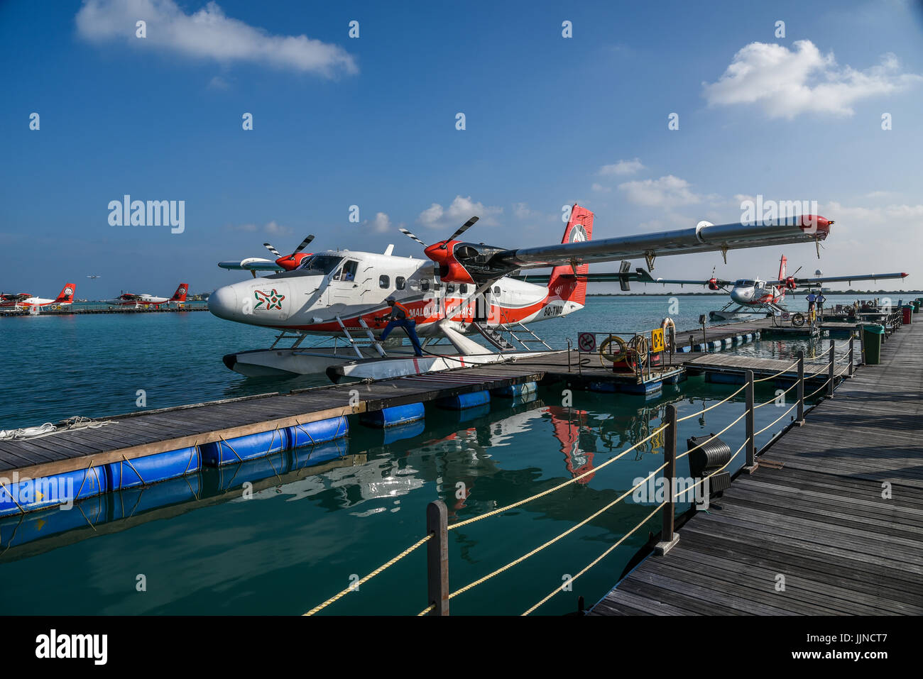 A seaplane undergoes refueling at the Seaplane Terminal at Male ...
