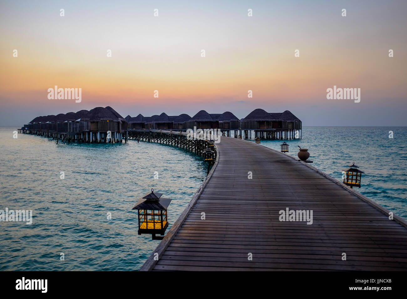 The jetty of a luxury resort leading from the island to the over-water ...