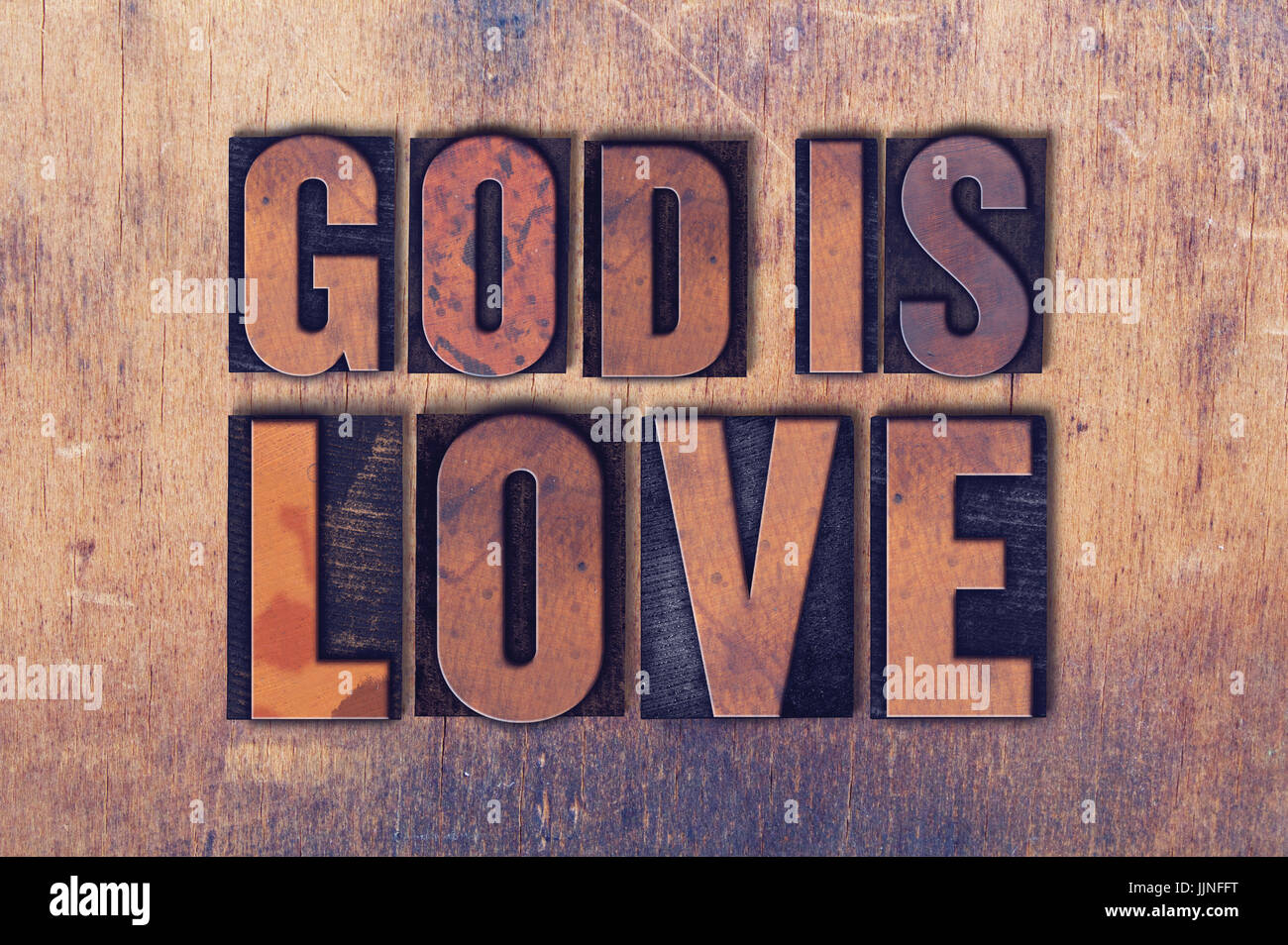 The words God Is Love concept and theme written in vintage wooden ...