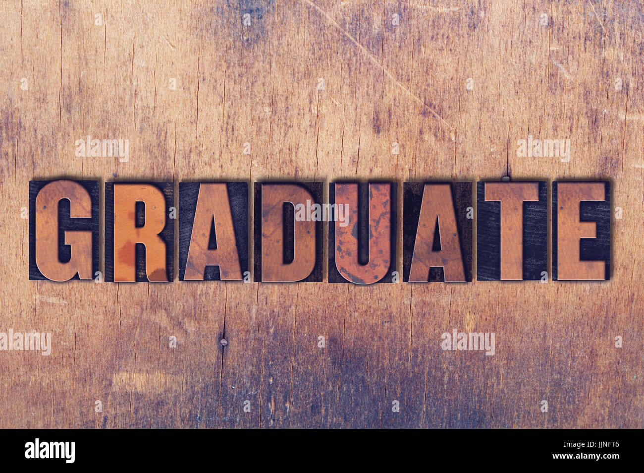 The word Graduate concept and theme written in vintage wooden ...