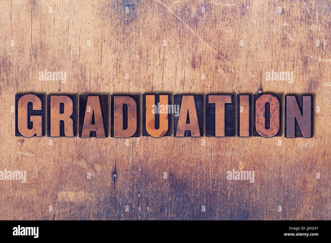 The word Graduation concept and theme written in vintage wooden ...