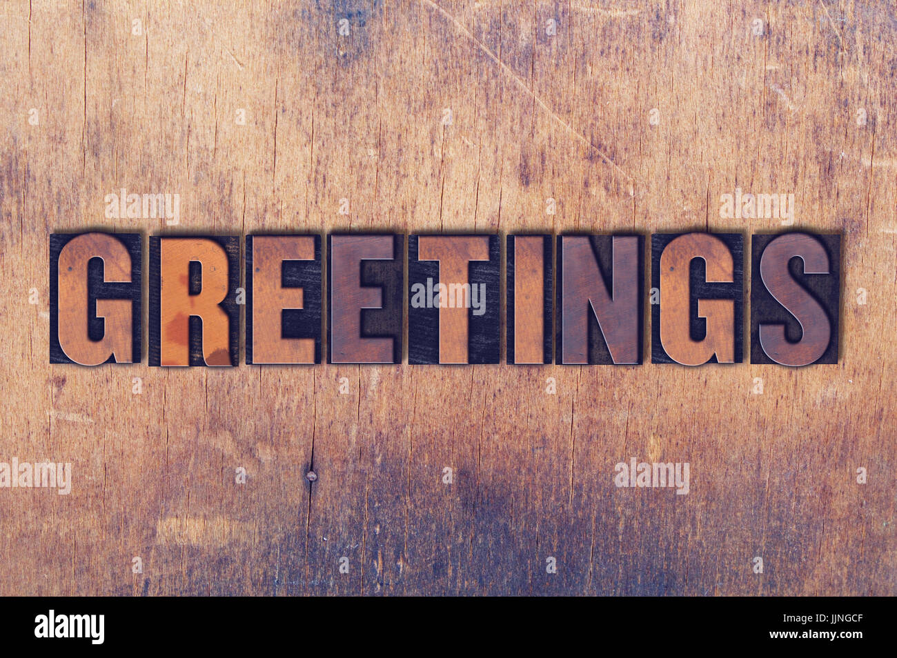 The word Greetings concept and theme written in vintage wooden ...