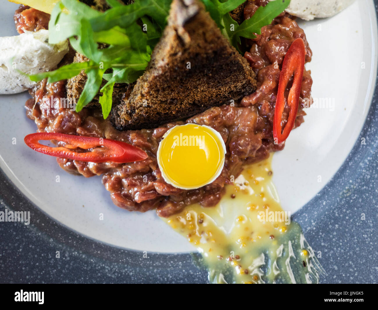 Ukrainian beef tartare with truffle cheese Stock Photo - Alamy