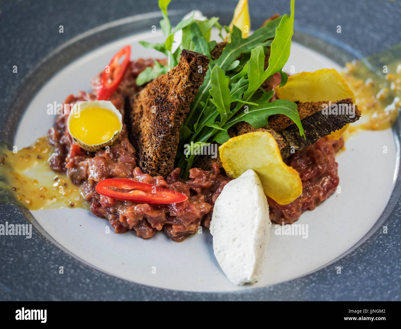 Ukrainian beef tartare with truffle cheese Stock Photo - Alamy