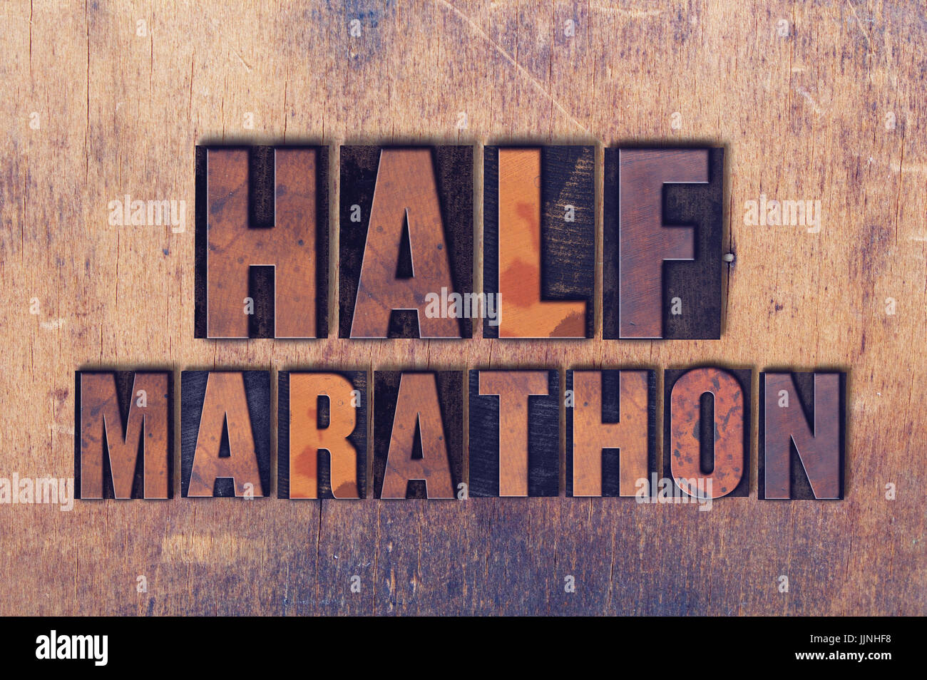 The words Half Marathon concept and theme written in vintage wooden ...
