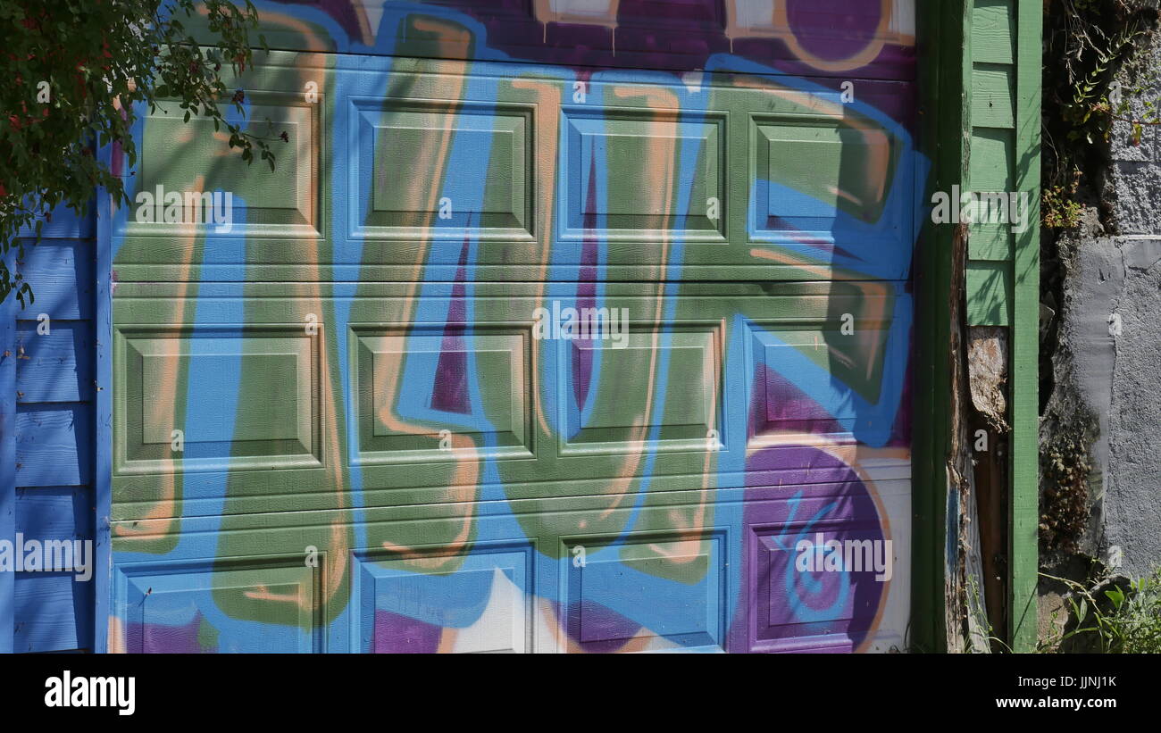 graffiti art on the front of a garage Stock Photo - Alamy
