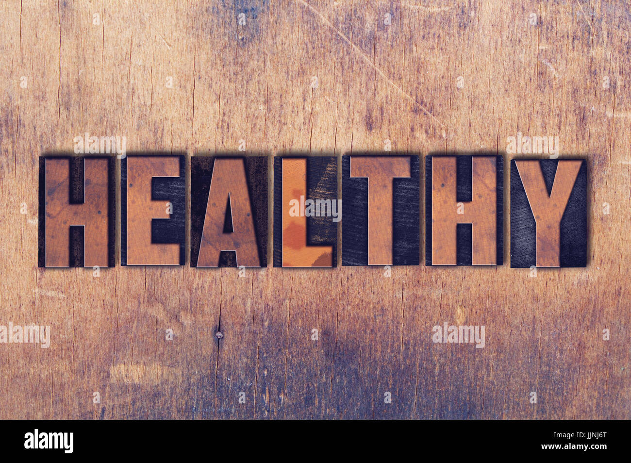 The word Healthy concept and theme written in vintage wooden ...
