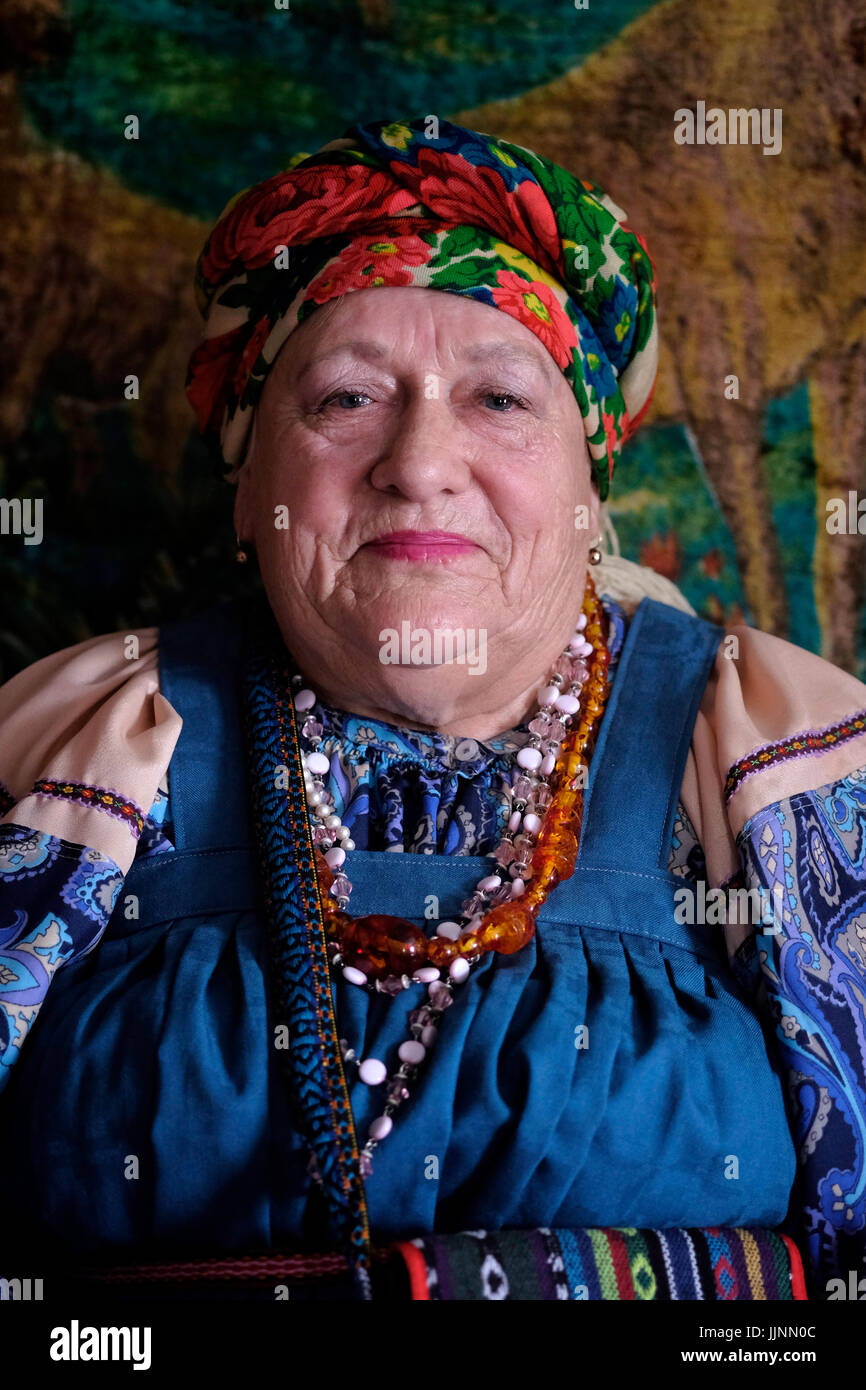 An elderly Russian woman wearing traditional sarafan dress in ...