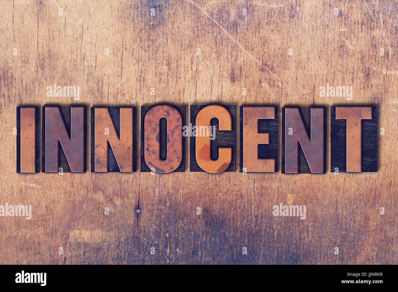 The word Innocent concept and theme written in vintage wooden ...