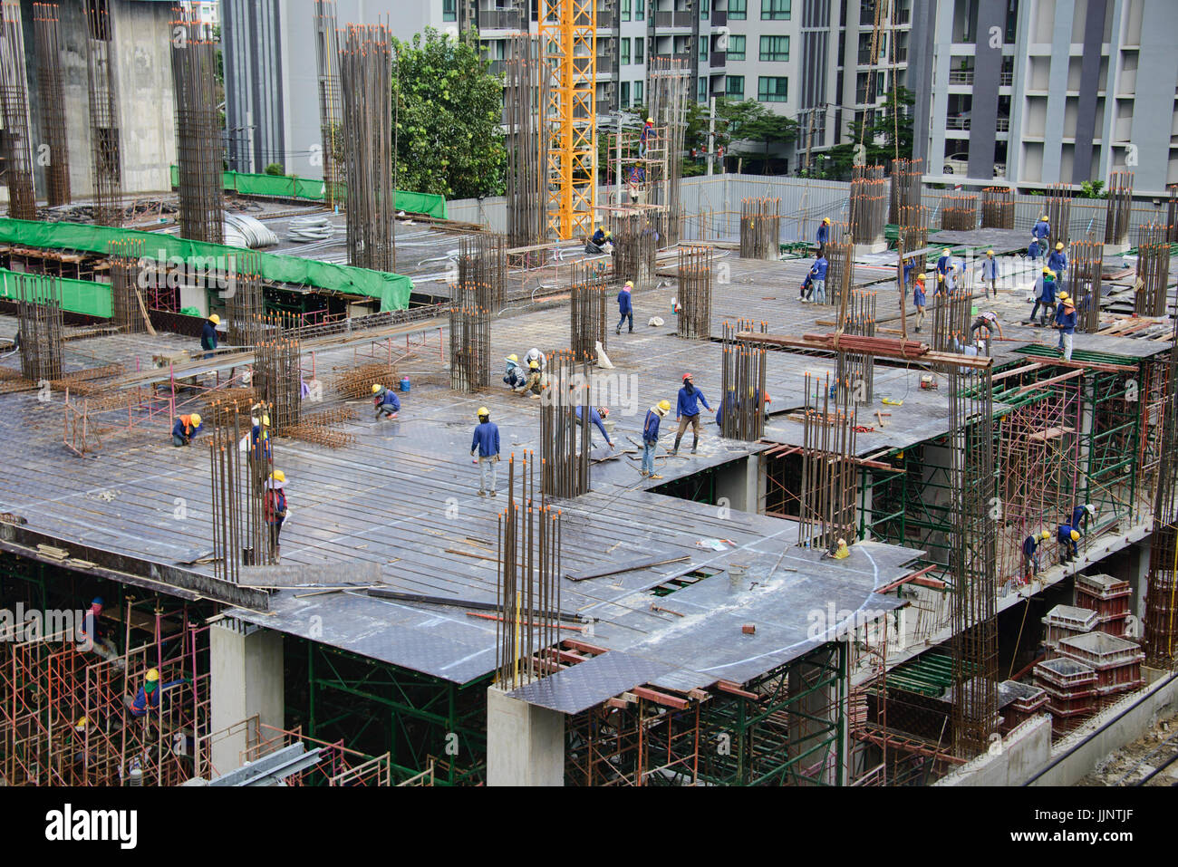 Construction workers on a high rise building in Bangkok, Thailand Stock ...