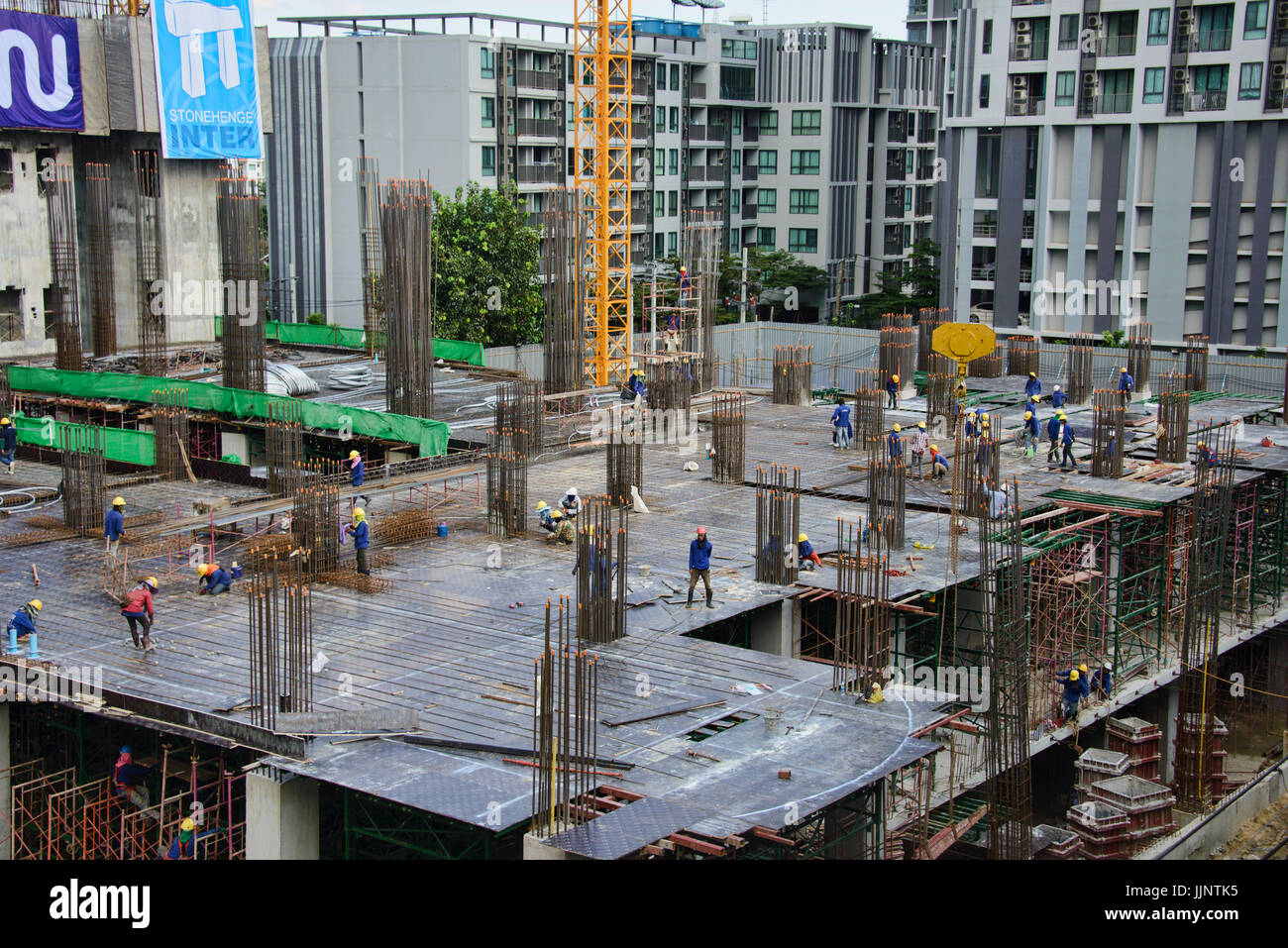 Construction workers on a high rise building in Bangkok, Thailand Stock ...