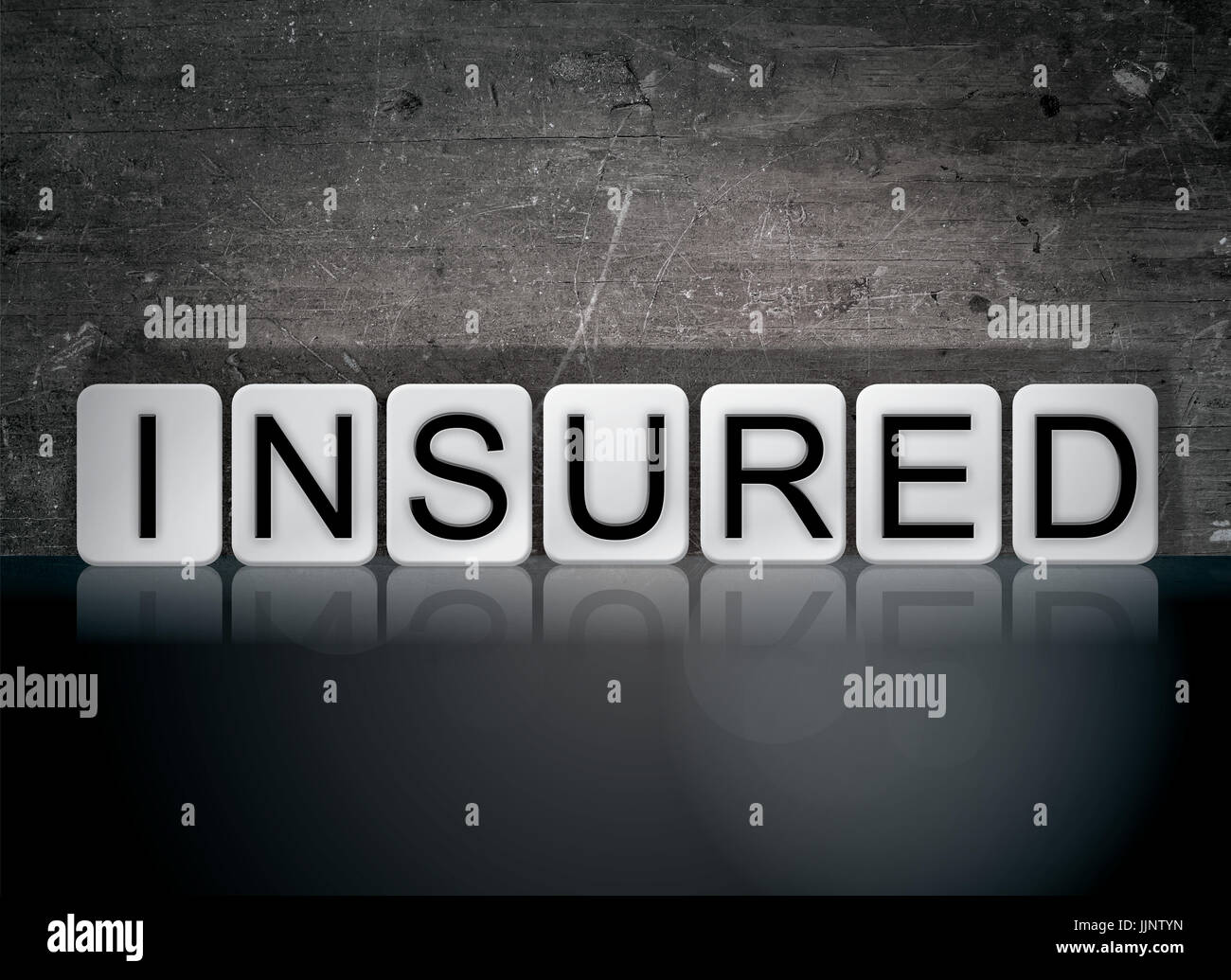 The word Insured concept and theme written in white tiles on a dark ...