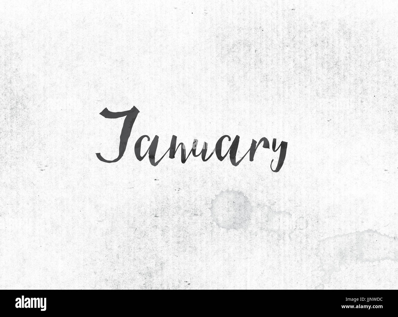 The word January concept and theme painted in black ink on a watercolor ...