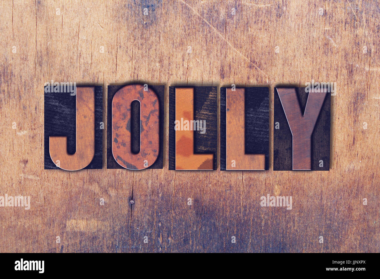 The word Jolly concept and theme written in vintage wooden letterpress ...