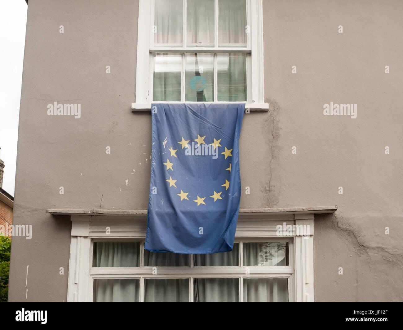 a european flag draped outside of a window; Essex; UK Stock Photo - Alamy