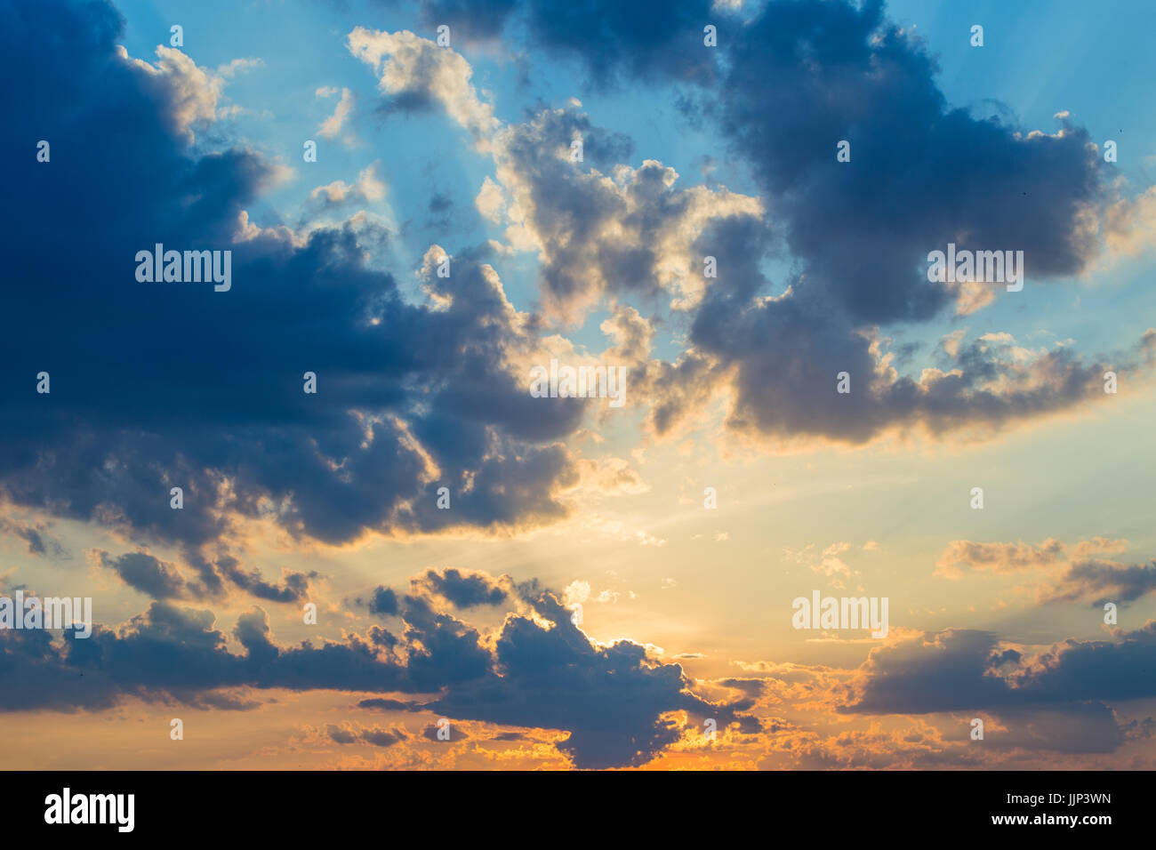 Beautiful dramatic scenic sunset or sunrise colored sky with clouds ...