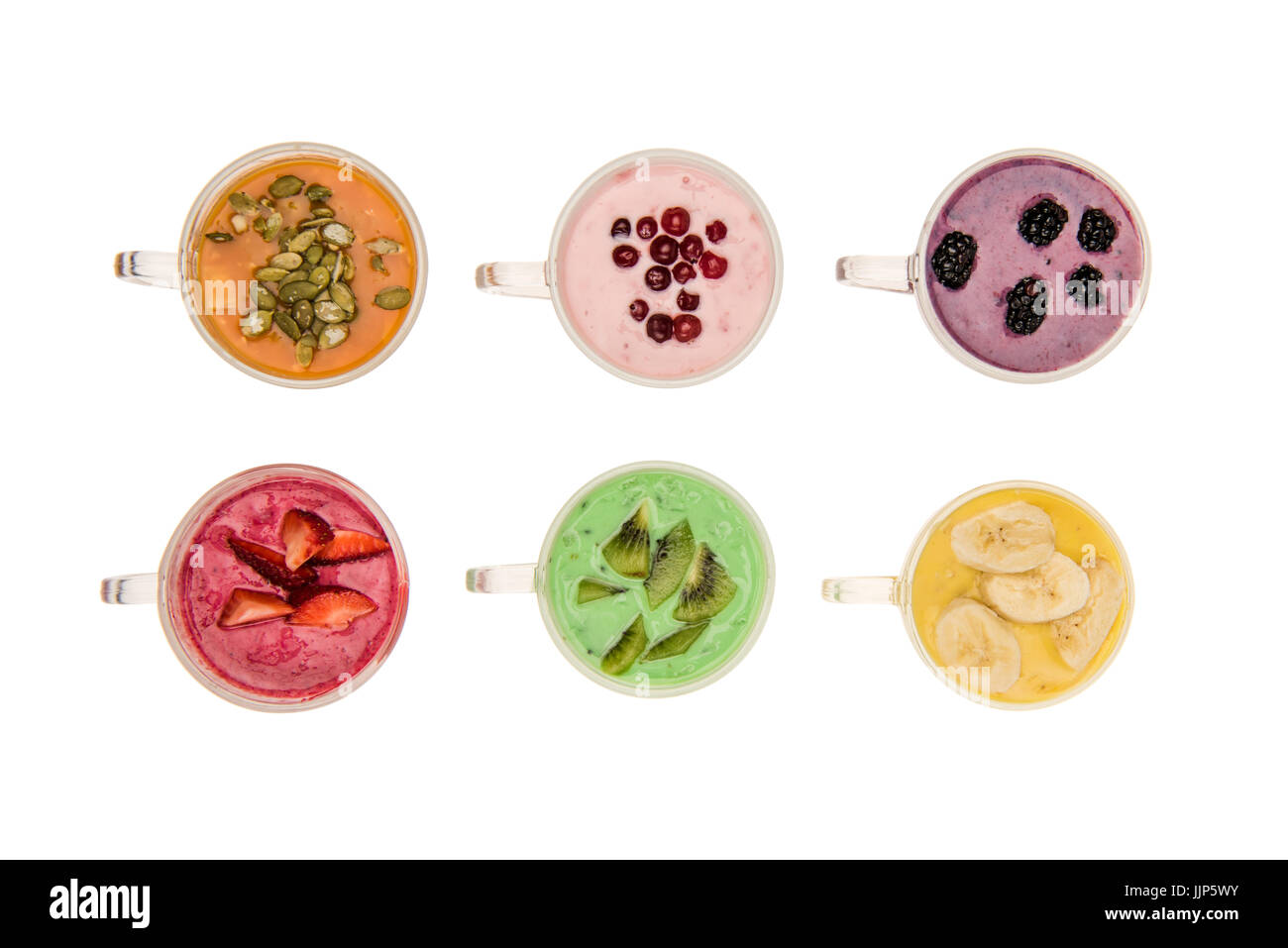 Top view of fresh fruit smoothies in glass cups isolated on white Stock ...