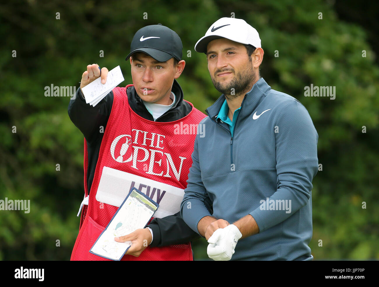 France's Alexander Levy speaks with his caddie during day one of The ...