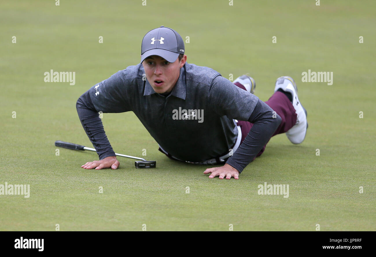 England's Matthew Fitzpatrick lines up a putt on the 18th during day ...