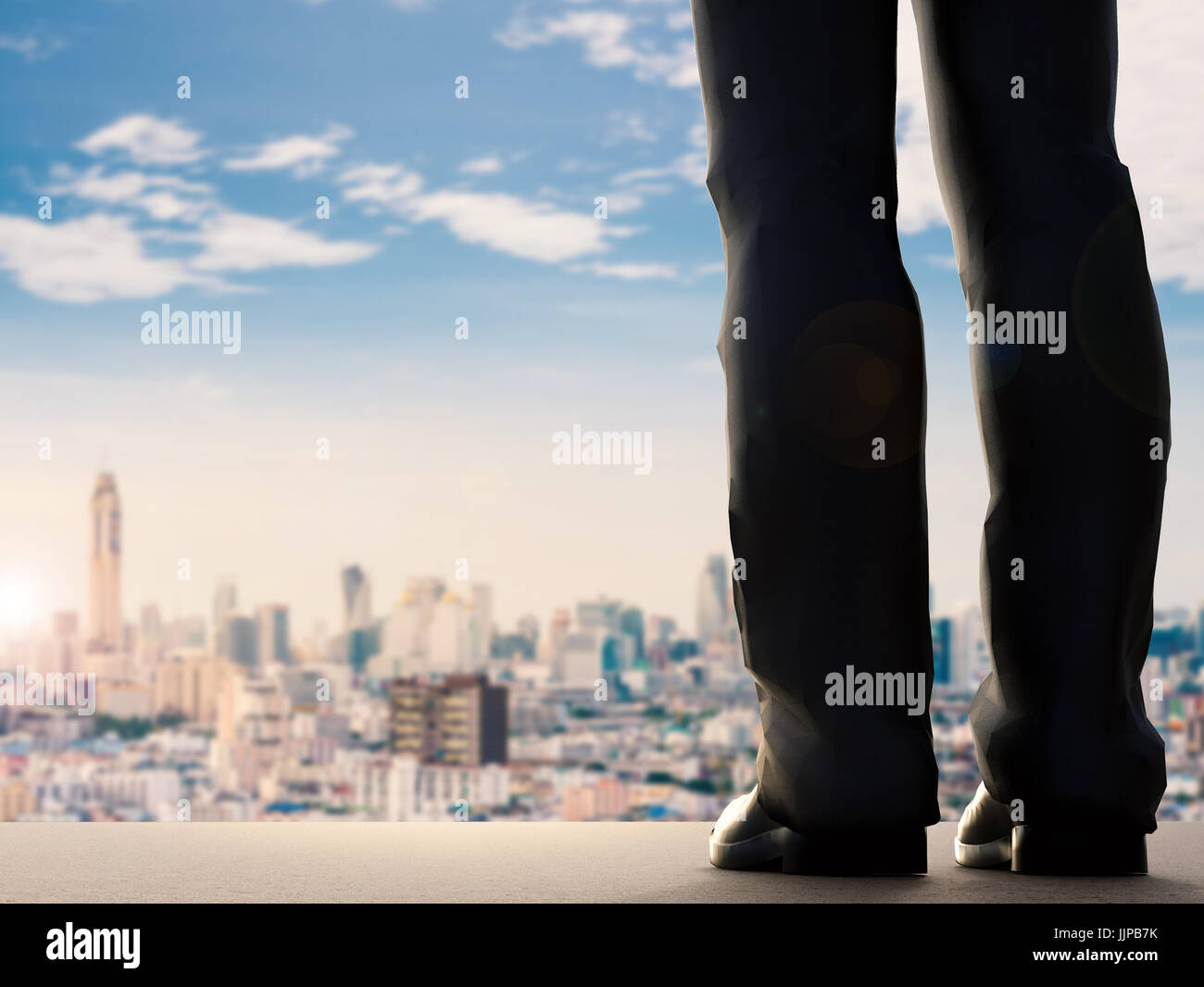rear view of businessman standing with cityscape background Stock Photo ...