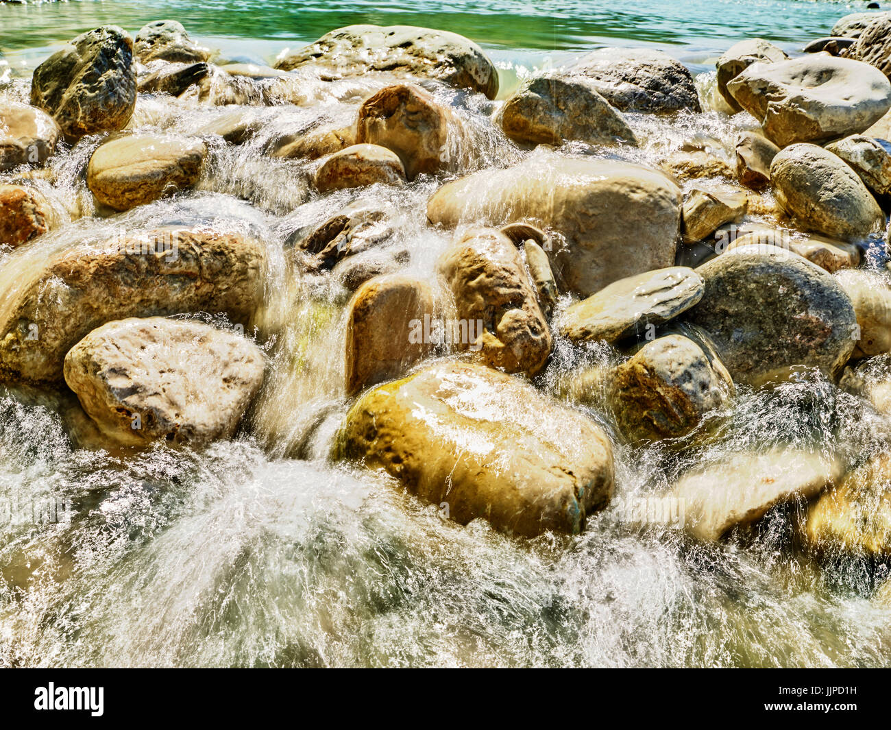 rocks, river pebbles in a streaming water Stock Photo - Alamy