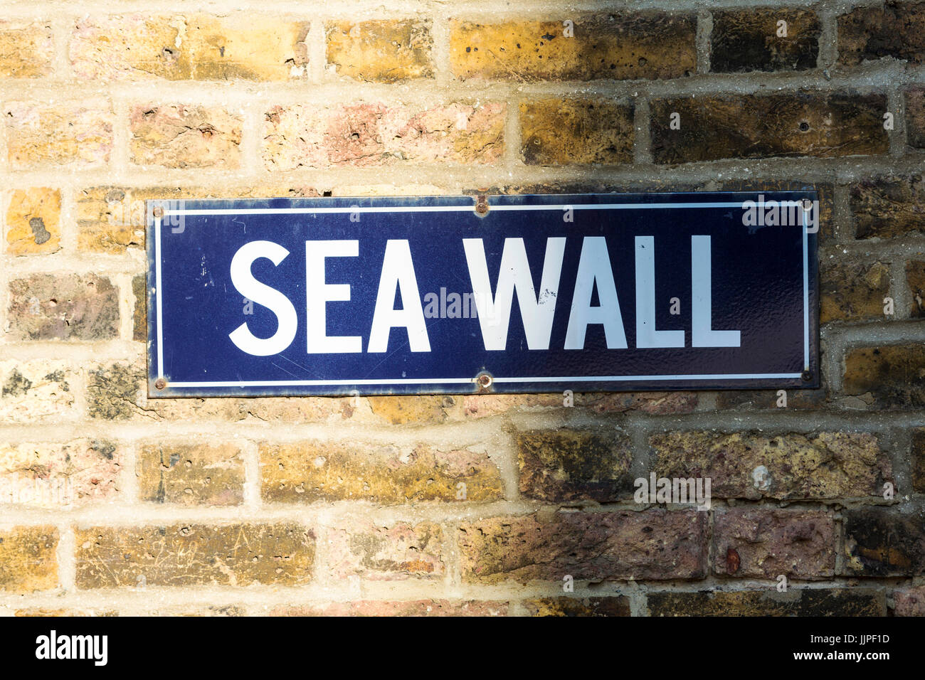 A road sign for Sea Wall in Whitstable Stock Photo - Alamy