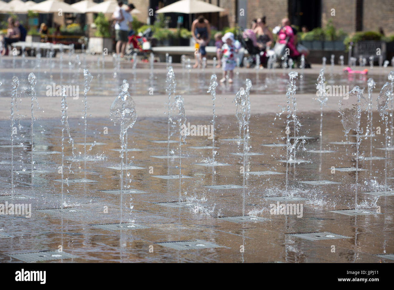 Fountains in Granary Square, London attract youngsters to cool down in ...