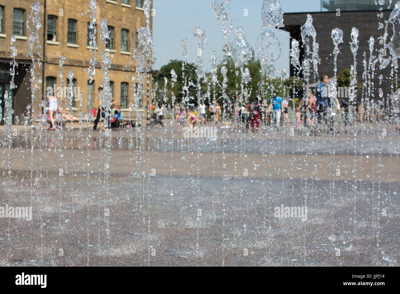Fountains in Granary Square, London attract youngsters to cool down in ...