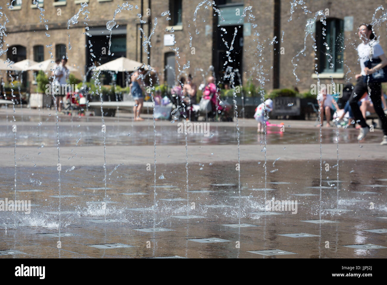Fountains in Granary Square, London attract youngsters to cool down in ...