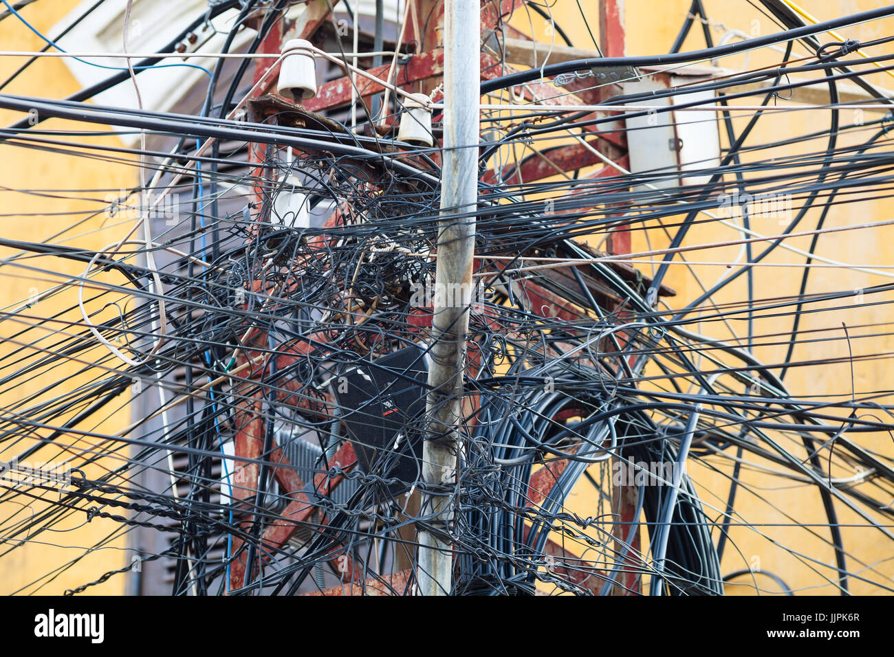 Messy cable infrastructure in Vietnam covering JBL speaker Stock Photo ...