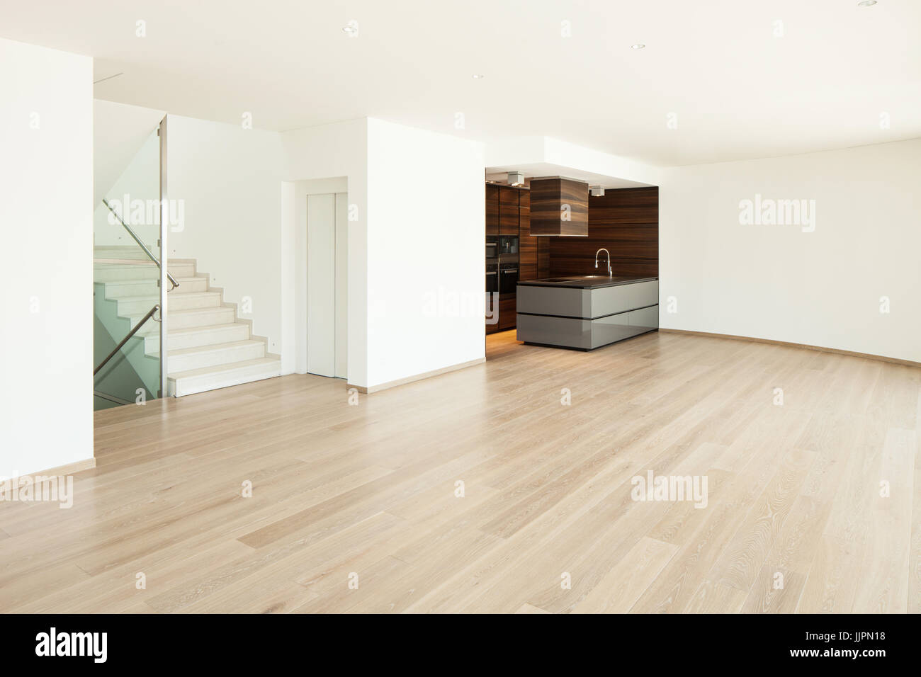 empty open space with kitchen and stairs Stock Photo - Alamy