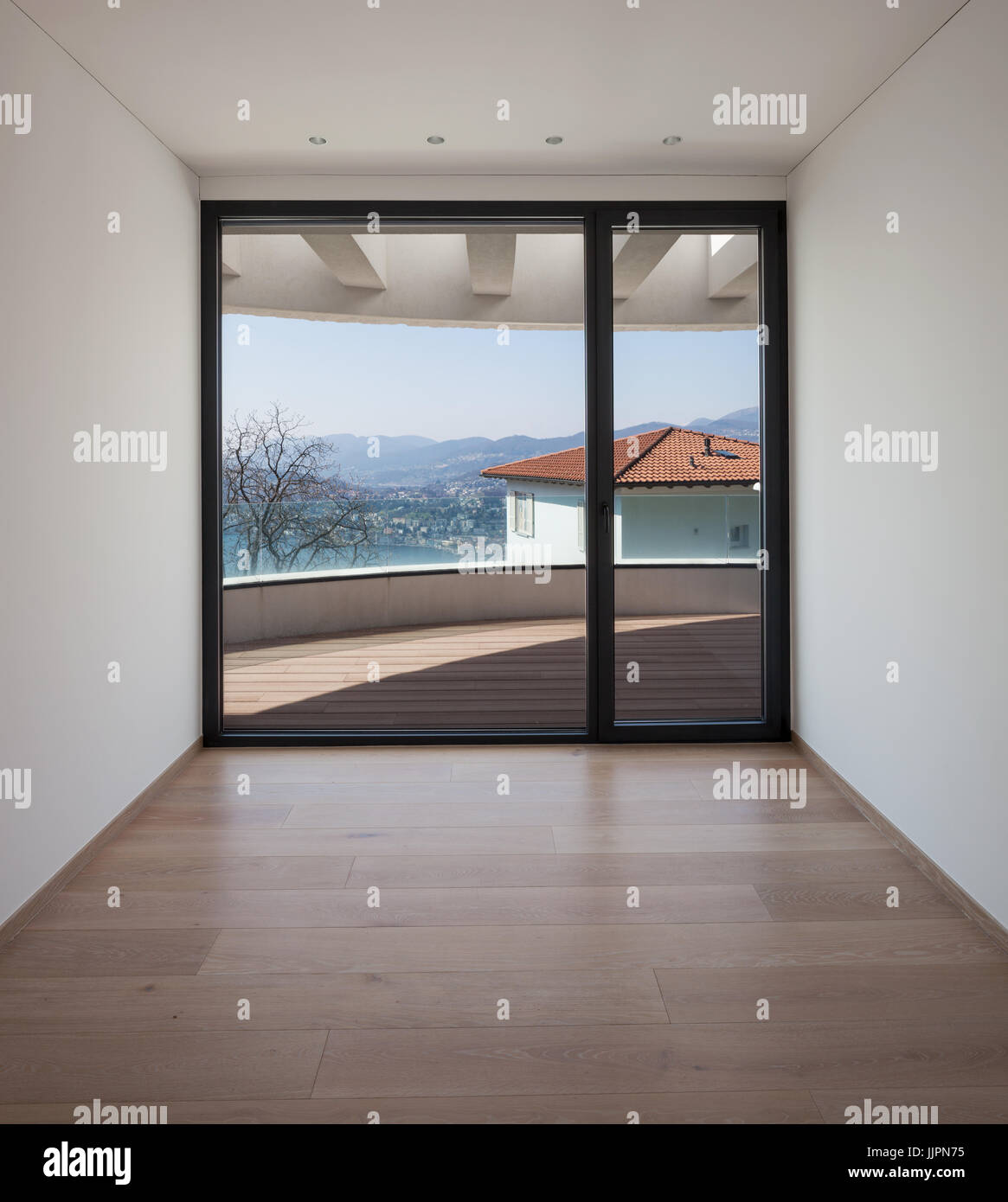 Empty room with window Stock Photo - Alamy