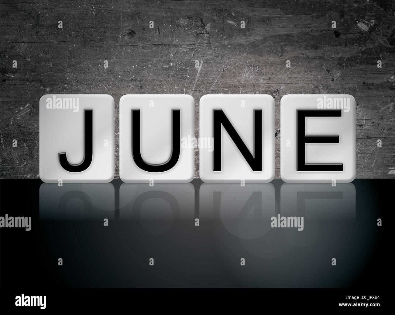 The word June concept and theme written in white tiles on a dark ...