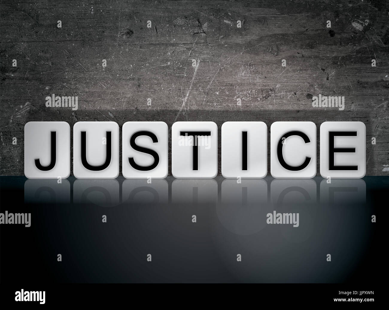 The word Justice concept and theme written in white tiles on a dark ...