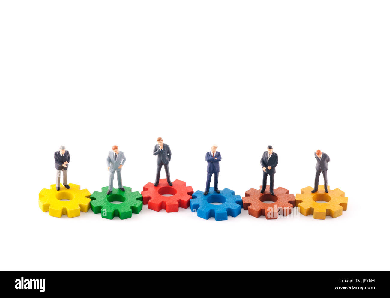Business figures on colorful gears isolated on white background Stock ...