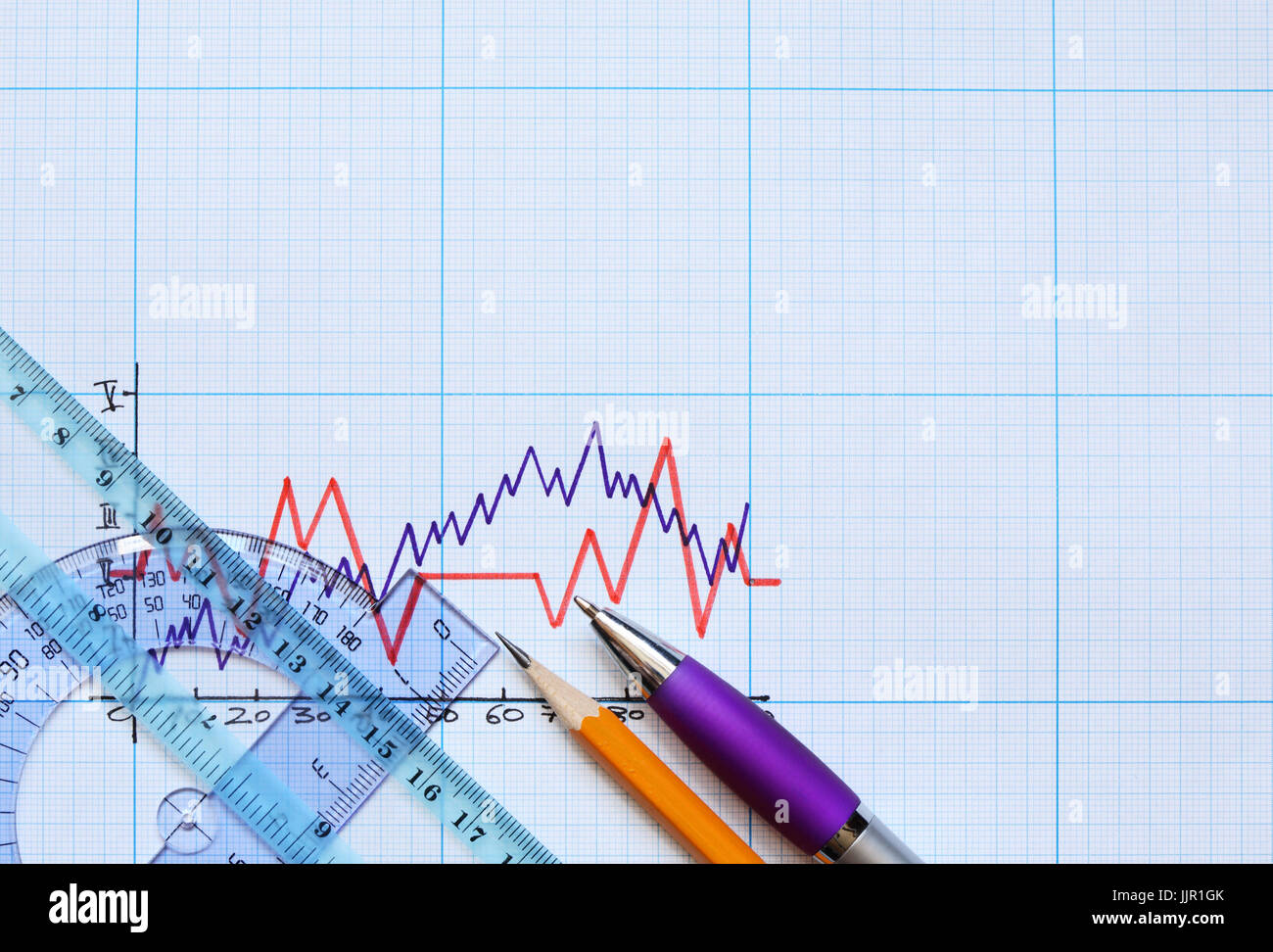 Rulers and pencil on graph paper with diagram Stock Photo - Alamy