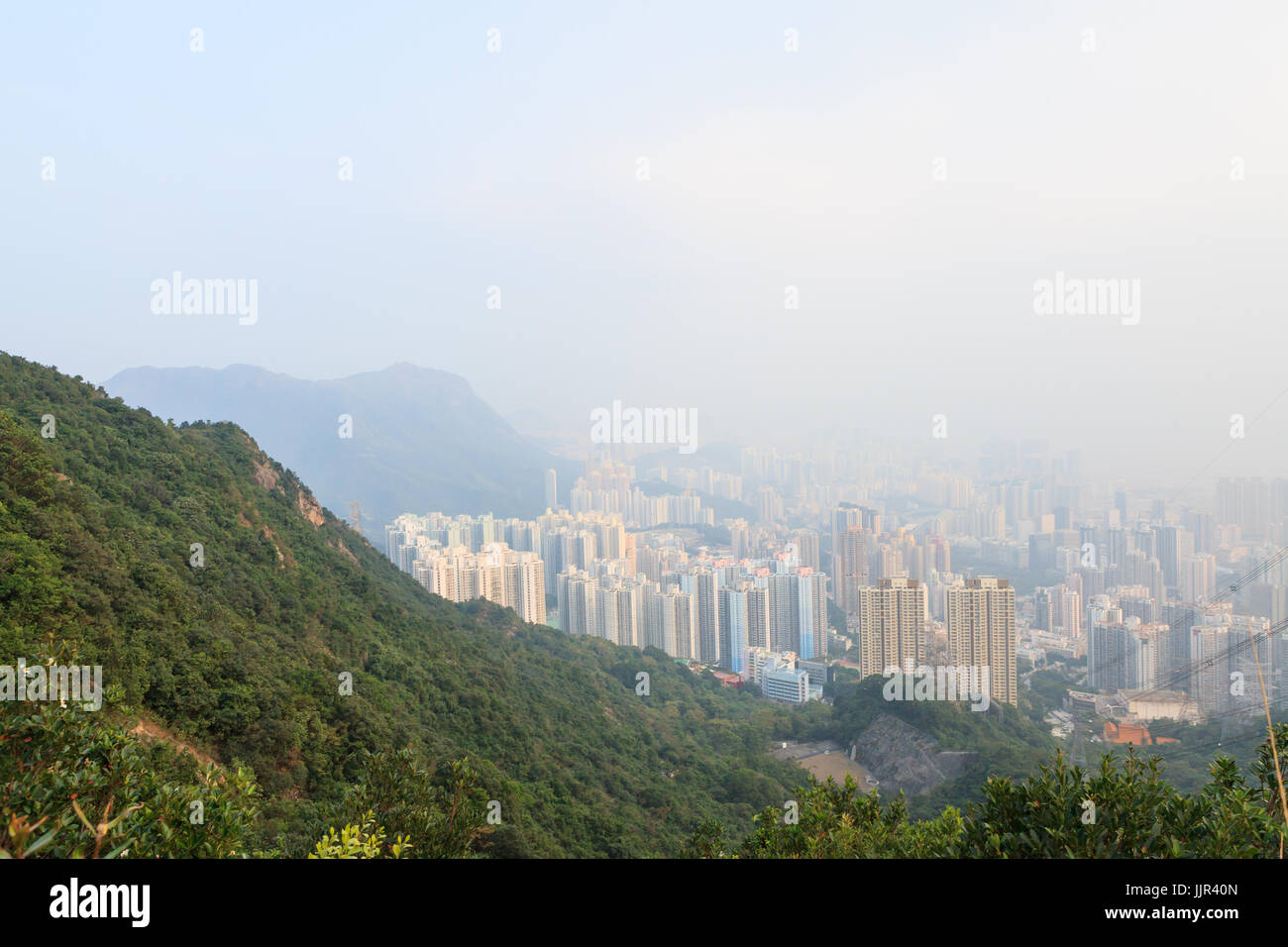 Hong kong tall buildings in haze Stock Photo - Alamy