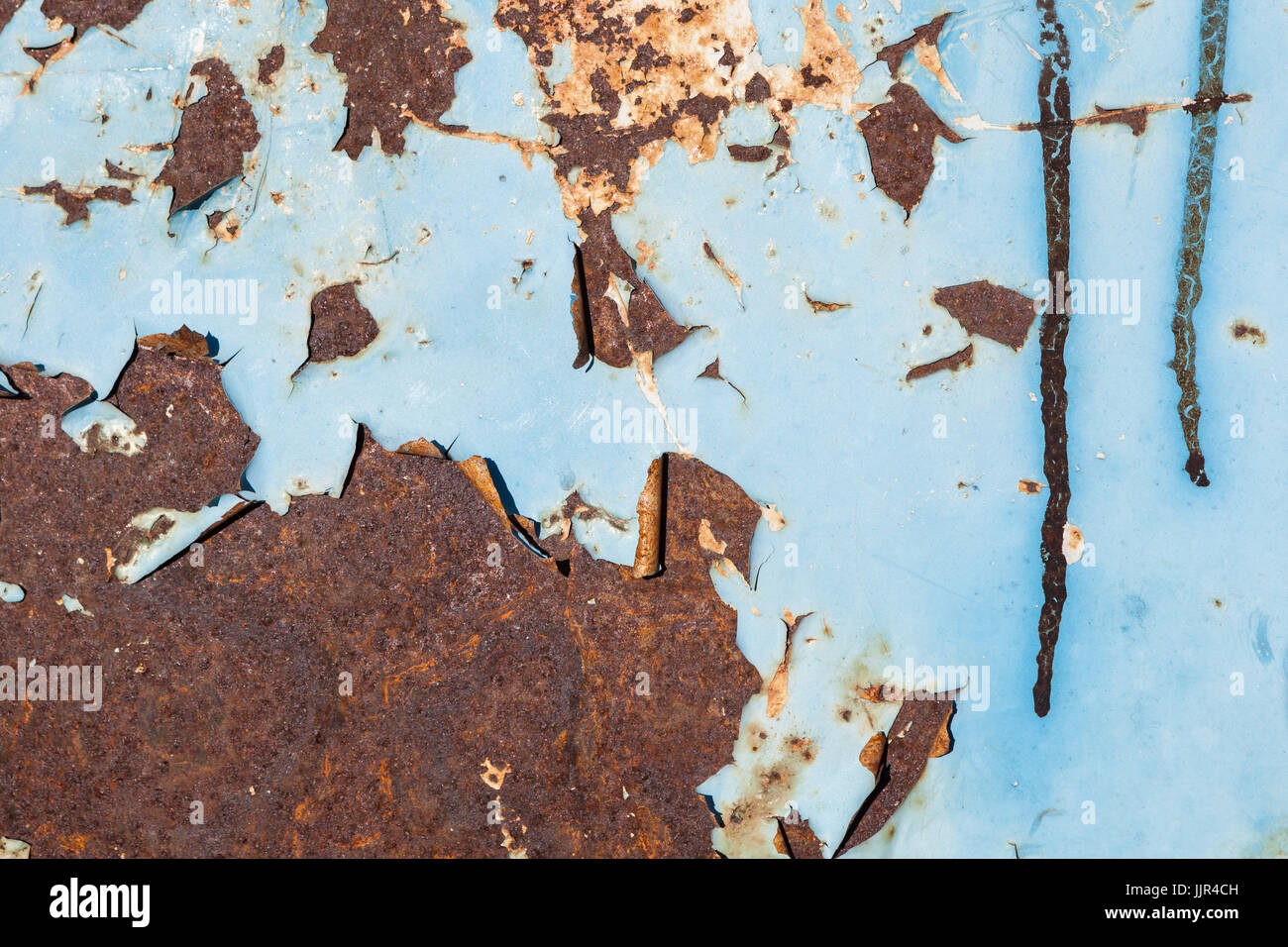 Blue paint peeling of from rusty metallic surface Stock Photo - Alamy