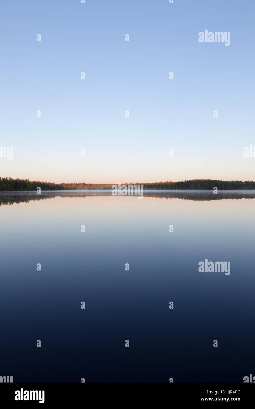 Still lake perfect reflection of sky Stock Photo - Alamy