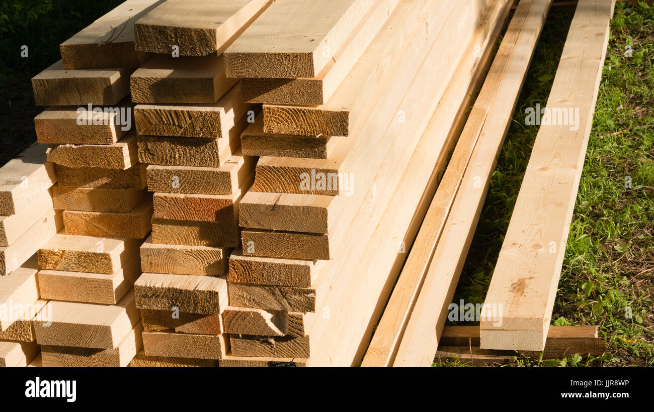 Piled comstruction boards. It is storaging on outdoors Stock Photo - Alamy