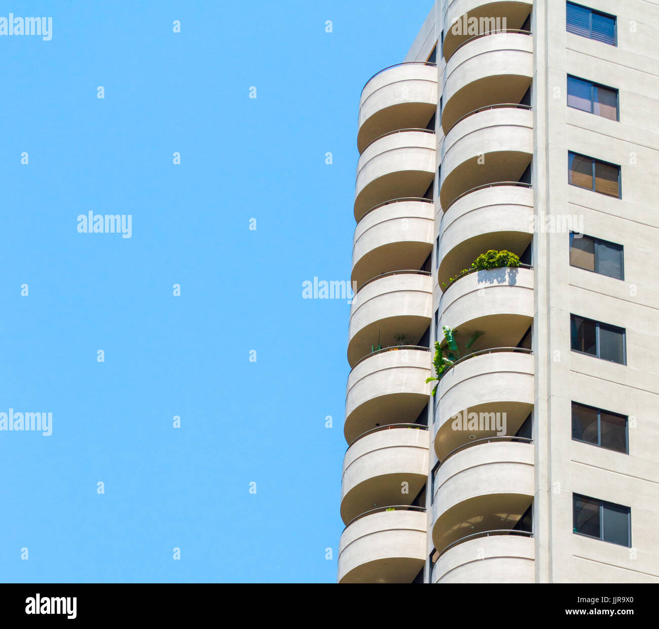 modern high rise building with unique curved design Stock Photo - Alamy