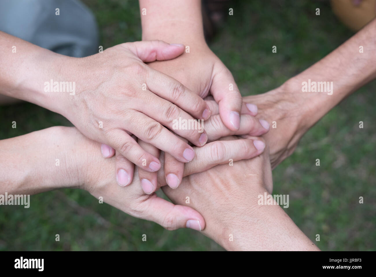 young college student joining united hand, start up business team ...
