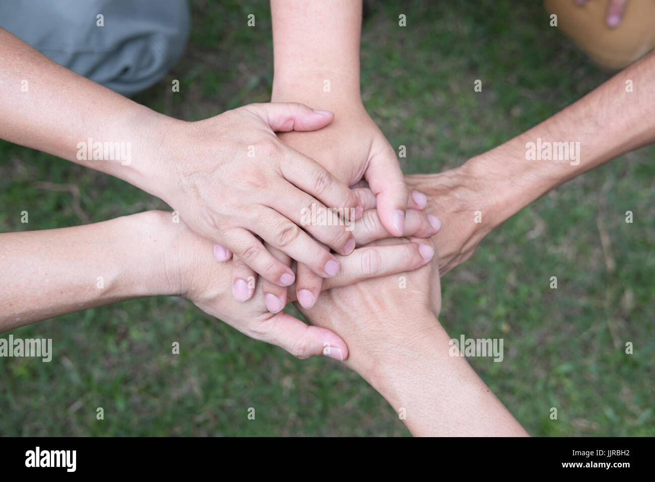 young college student joining united hand, start up business team ...