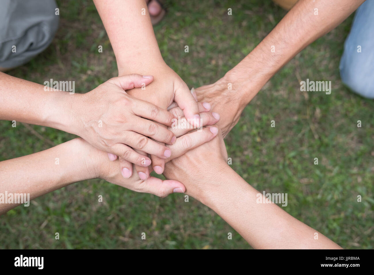 young college student joining united hand, start up business team ...