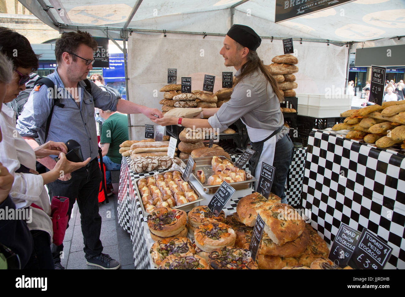 Market traders at King's Cross Real Food Market Stock Photo - Alamy