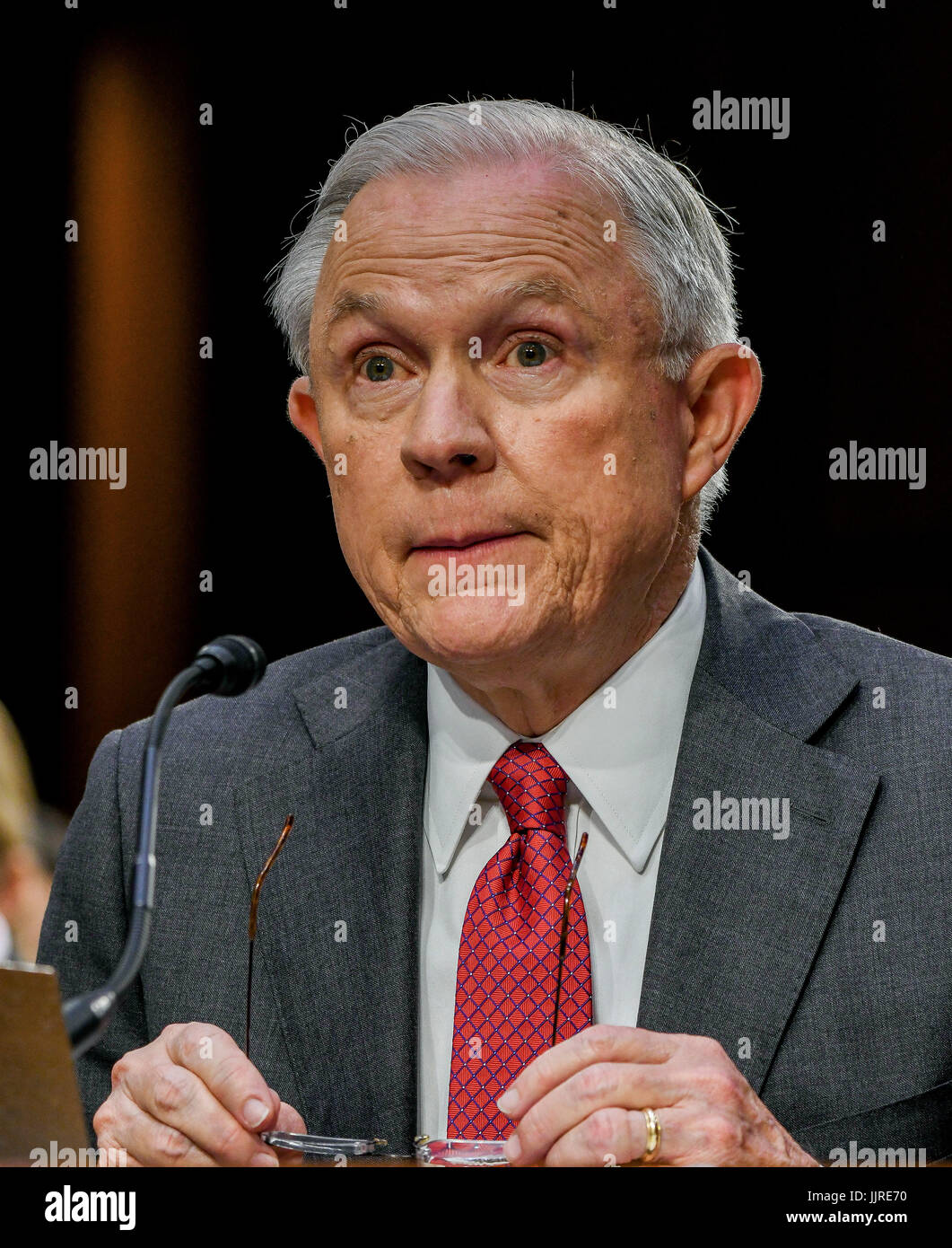 US. Attorney General Jeff Sessions reads from prepared answers in ...